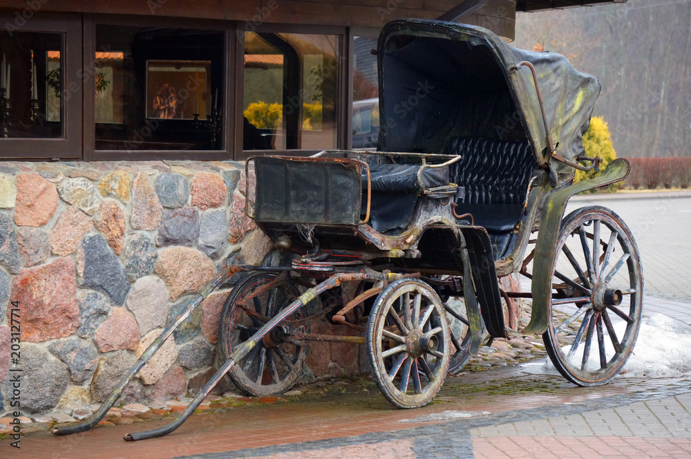 An old horse-drawn carriage. Vintage. Damage. Decorative. Stock Photo ...