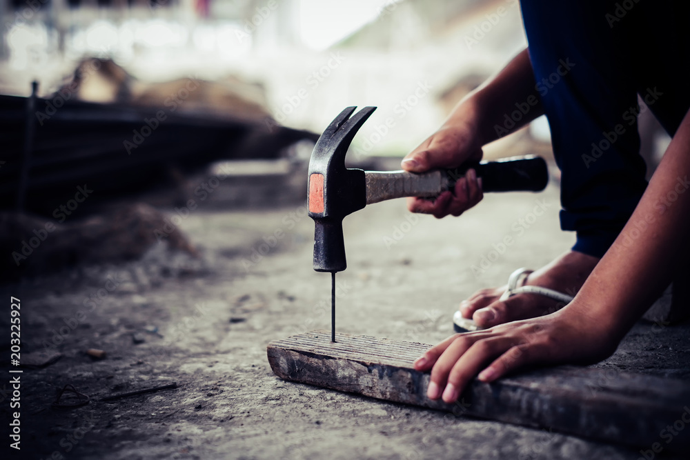 Little girl labor working in commercial building structure, World Day ...