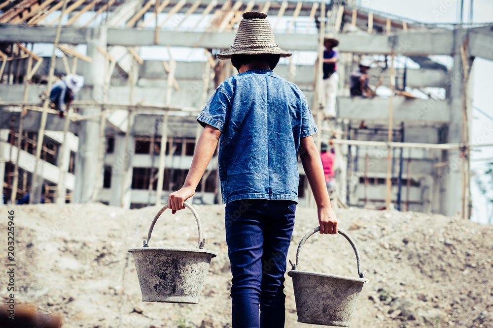 Little girl labor working in commercial building structure, World Day ...