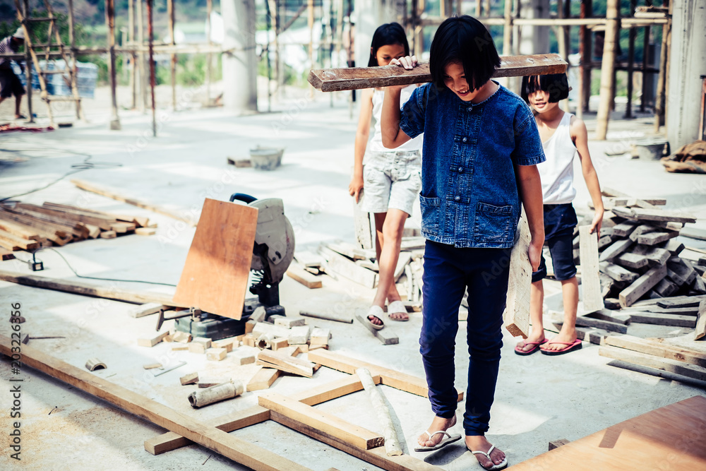 Little girl labor working in commercial building structure, World Day ...