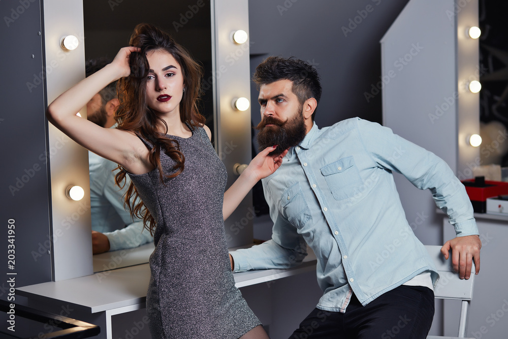 Professional hairdresser with long hair model. Haircutter and beautiful ...