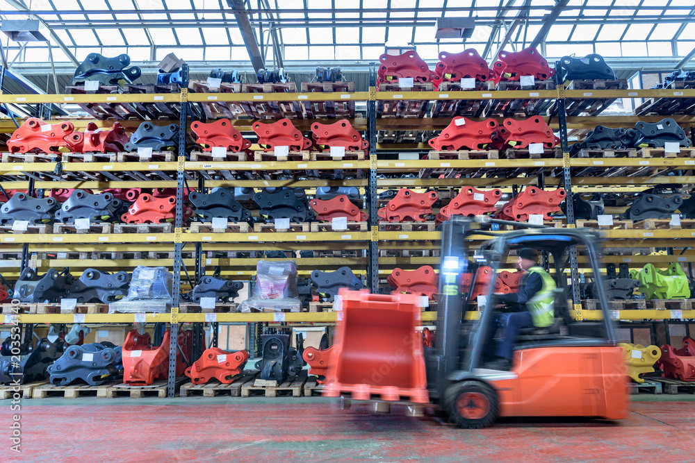 Forklift with product in storage area in engineering factory Stock ...