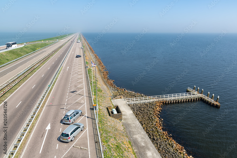 Dutch highway at the afsluitdijk. The dike is the connection between ...
