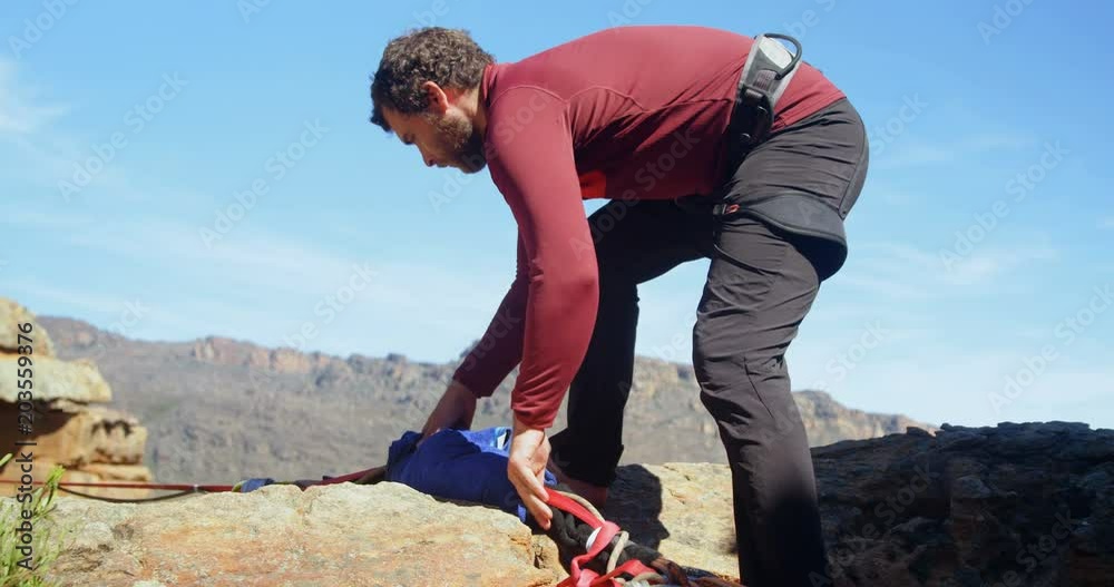 Mountaineer prepares the rope for tightrope walking Stock Video | Adobe ...