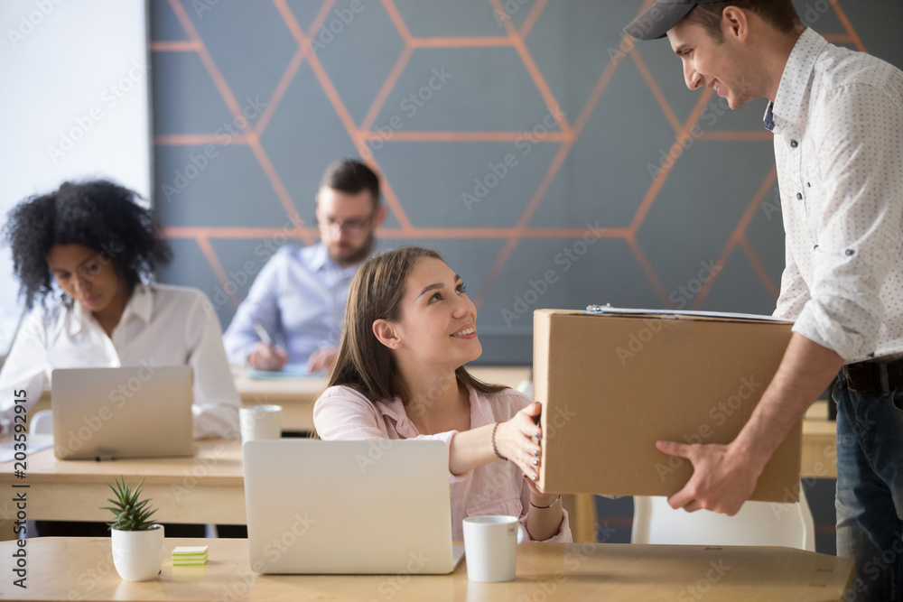 Office delivery service concept, millennial woman receiving box from ...