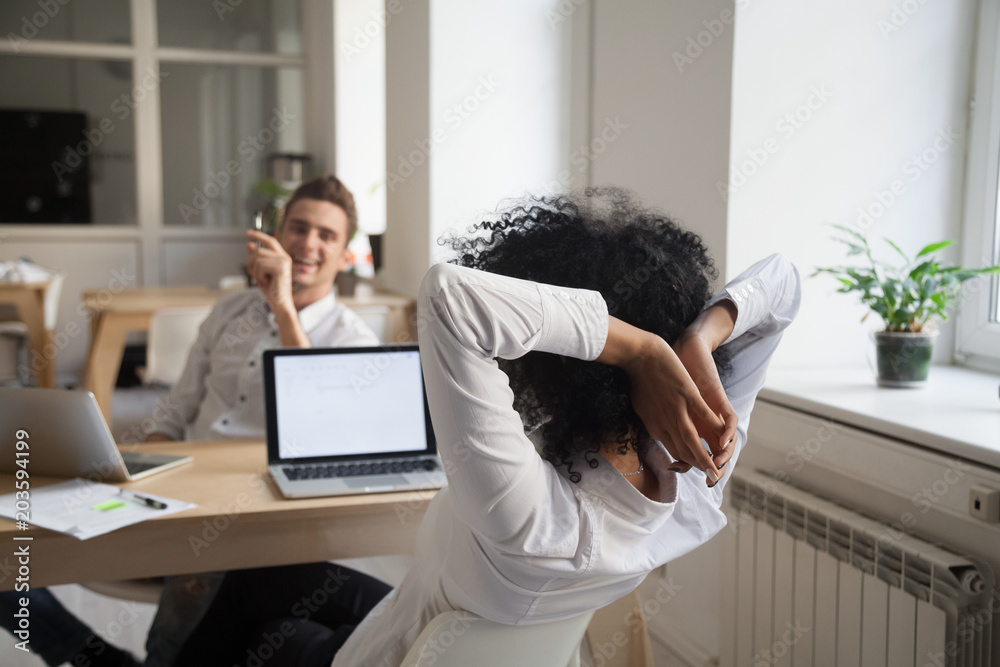 Diverse colleagues relaxing talking in office, multiracial colleagues ...