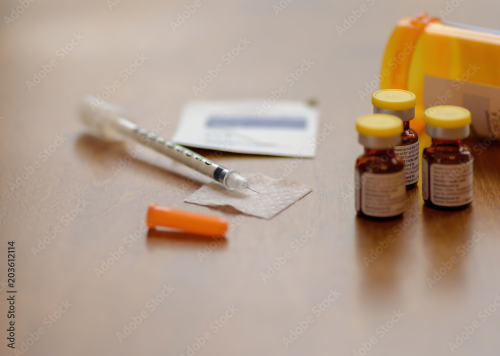 Preparing for an injection with needle and vials of medicine Stock ...