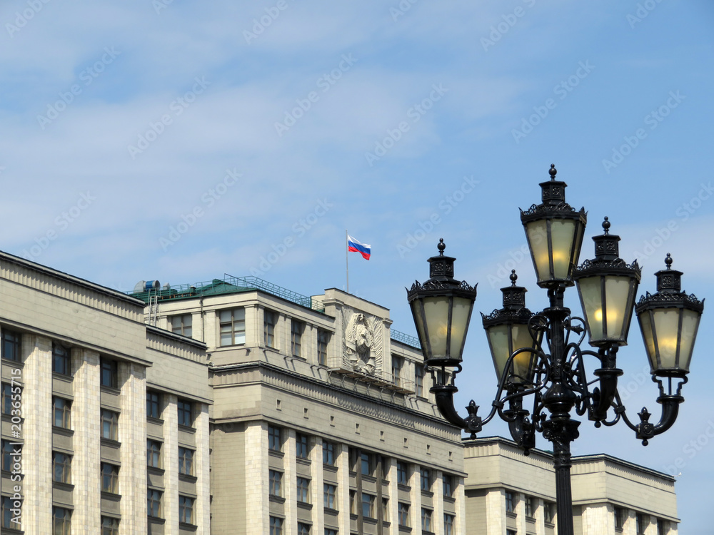 Russian flag over the building of Russian parliament in Moscow. Symbol ...