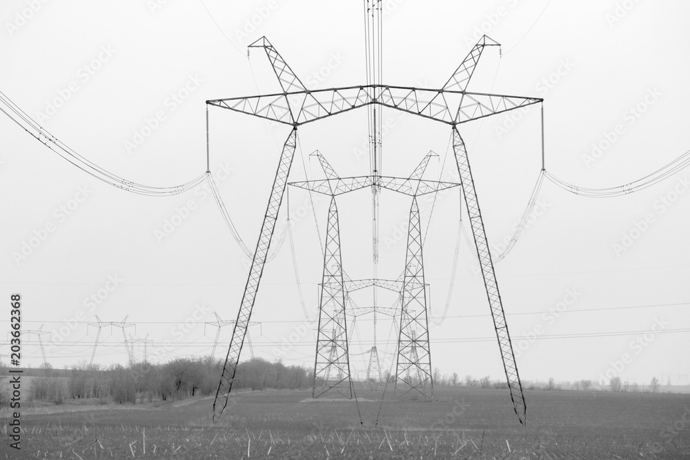 High voltage electric power line towers (black and white) Stock Photo ...