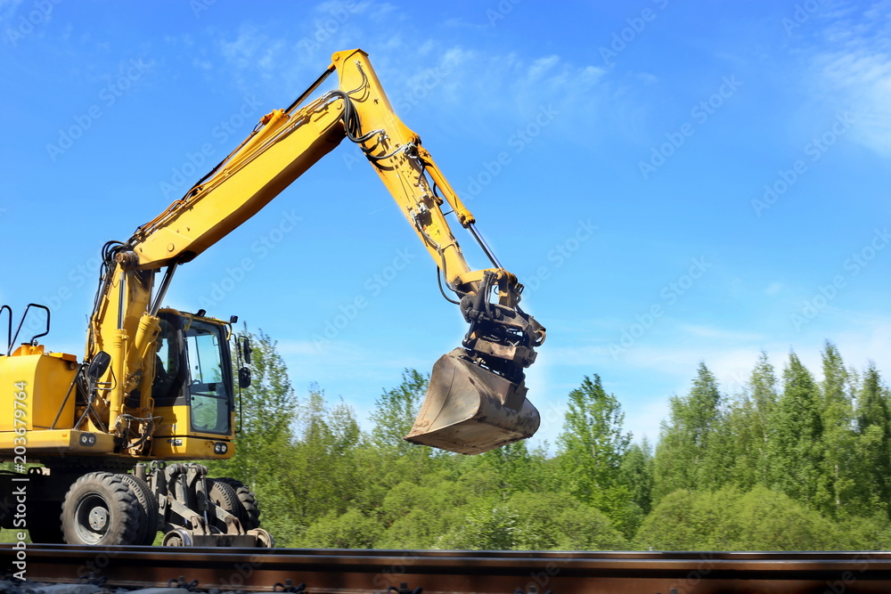 Rail excavator working with rubble. Excavators machine excavate on ...