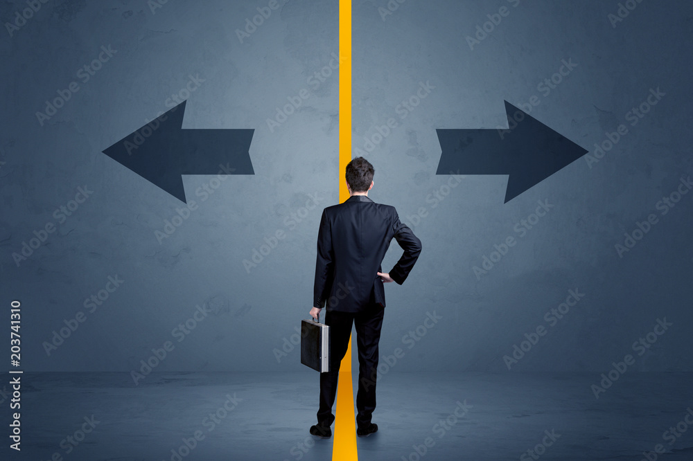 Business person choosing between two options separated by a yellow ...