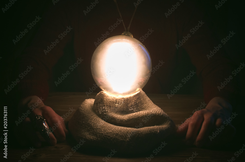 Crystal ball and fortune teller hands. Divination concept. The ...