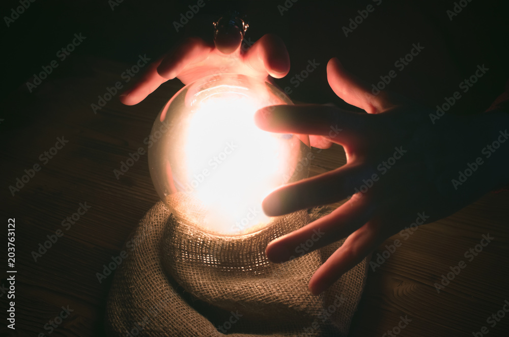 Crystal ball and fortune teller hands. Divination concept. The ...