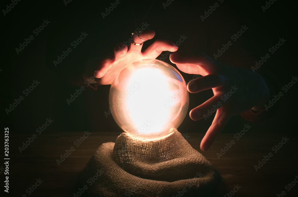 Crystal ball and fortune teller hands. Divination concept. The ...