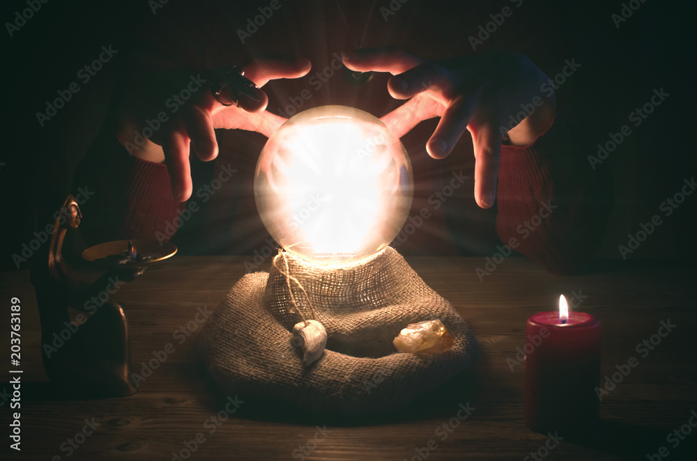 Crystal ball and fortune teller hands. Divination concept. The ...