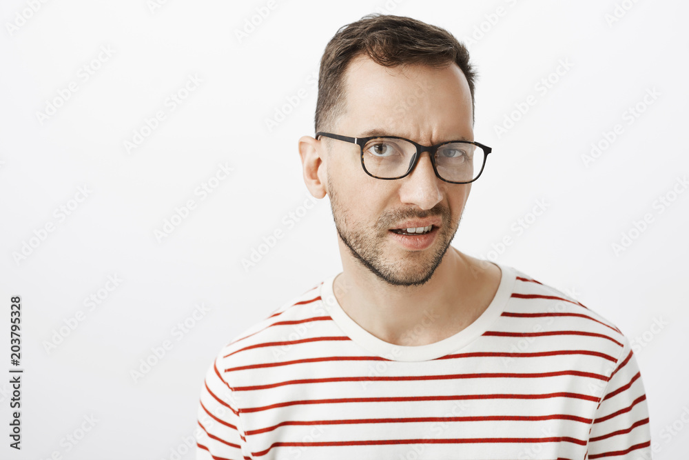 Are you kidding me. Displeased hesitating attractive guy in black ...