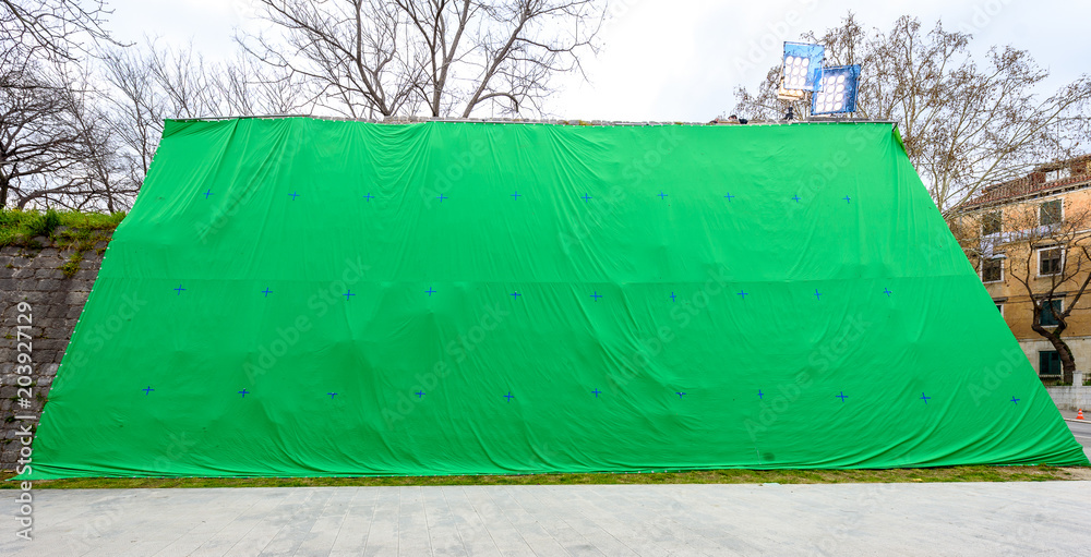Giant green screen chroma key background on commercial set. Stock Photo ...
