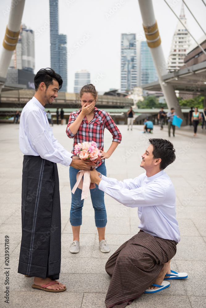 LGBT gay couple with jealous sad girl Stock Photo | Adobe Stock