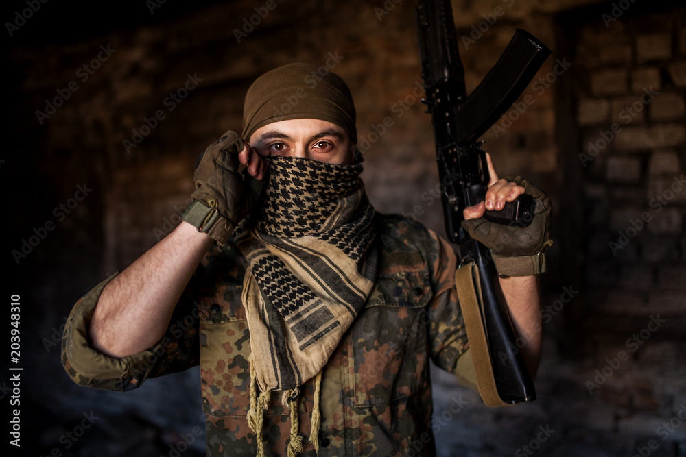 The Arab soldier with the AK-47 Kalashnikov assault rifle Stock Photo ...