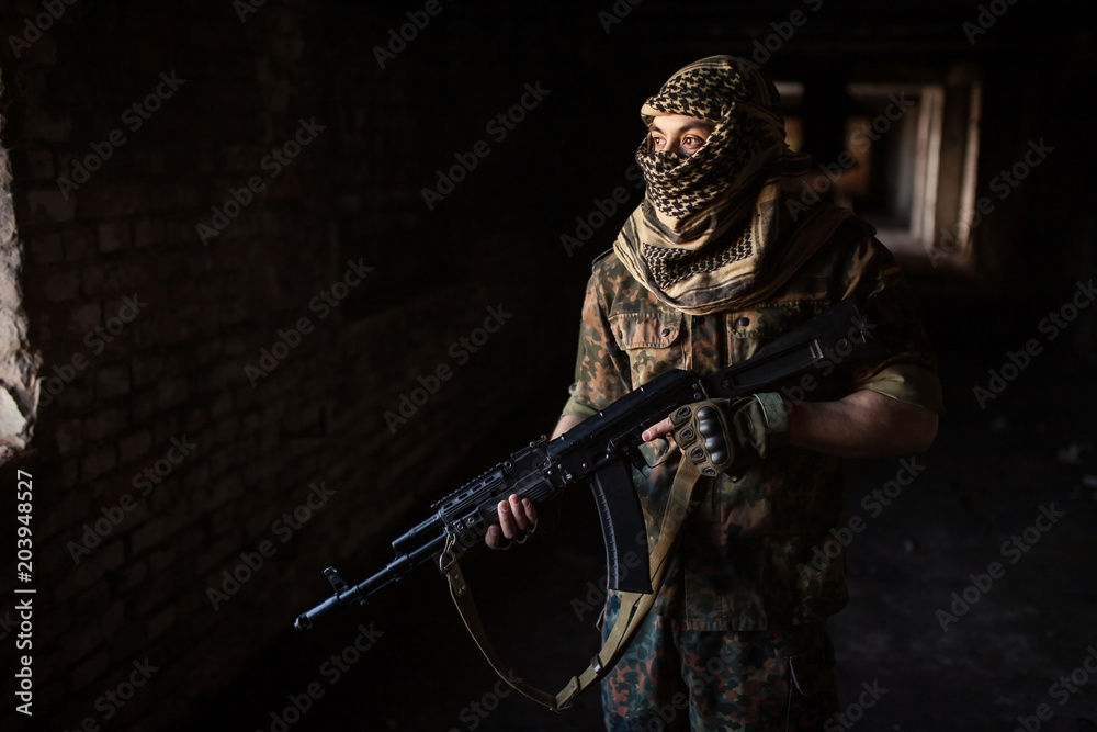 The Arab soldier with the AK-47 Kalashnikov assault rifle Stock Photo ...