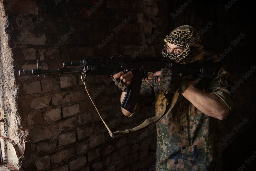Arab soldier aiming with Kalashnikov AK-47 assault rifle Stock Photo ...