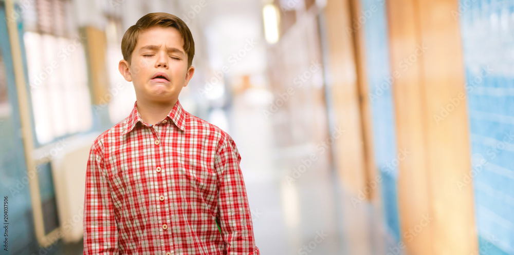 Foto de Handsome toddler child with green eyes crying depressed full of ...