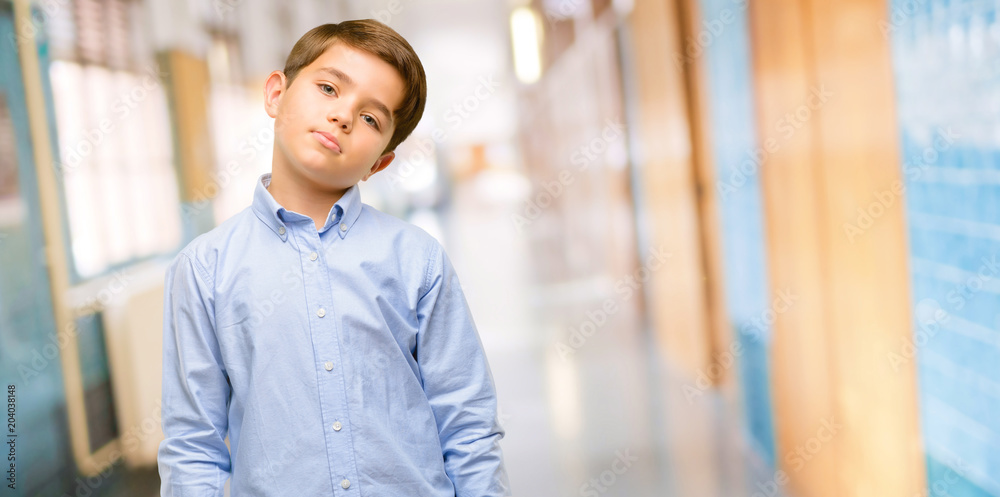 Handsome toddler child with green eyes with sleepy expression, being ...
