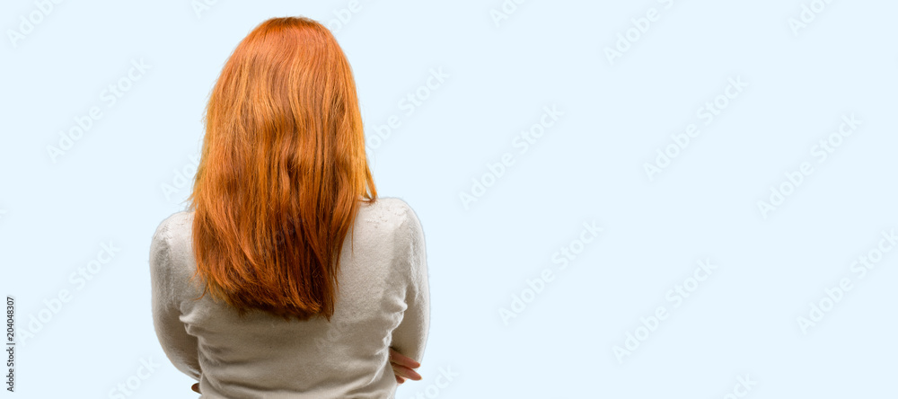 Beautiful Young Redhead Woman Backside Rear View Isolated Over Blue