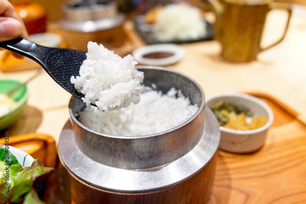 hot Japanese rice served in an old style rice cooker was pick with ...