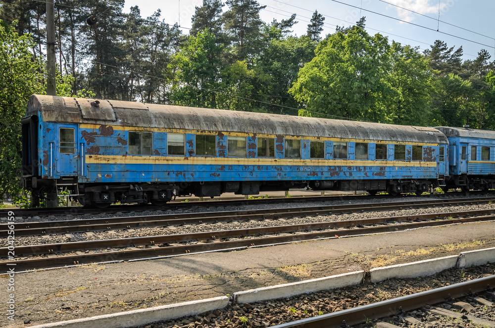 Old railway carriage at a railway station Stock Photo | Adobe Stock