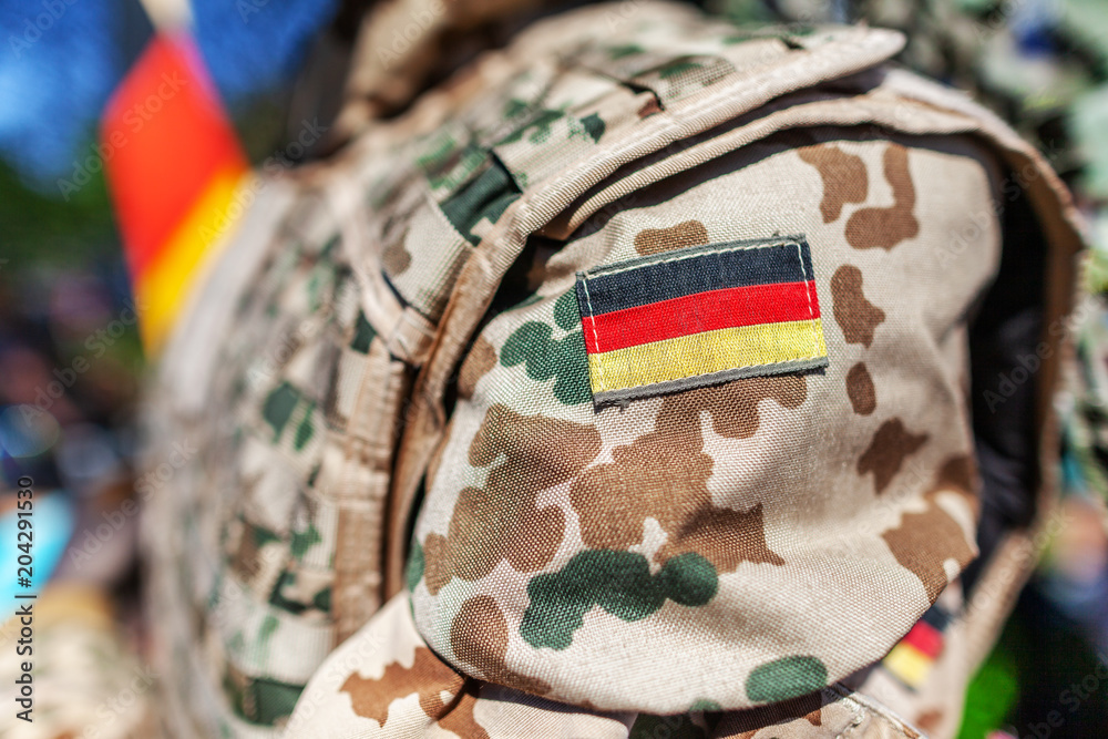 german flag on a german soldier desert uniform Stock Photo | Adobe Stock