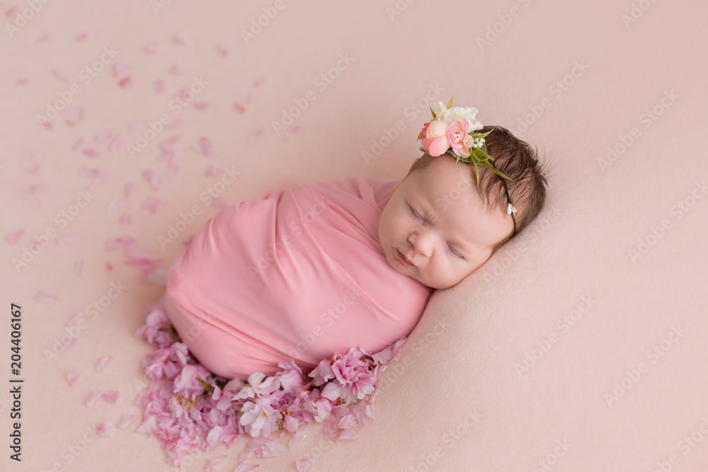 newborn girl. newborn photo shoot. newborn in pink on a pink background ...