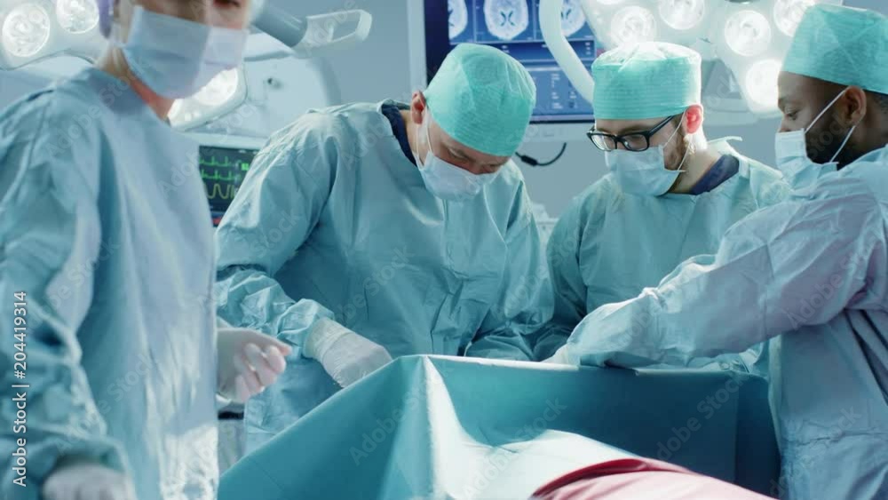 Diverse Team of Professional surgeon, Assistants and Nurses Performing ...