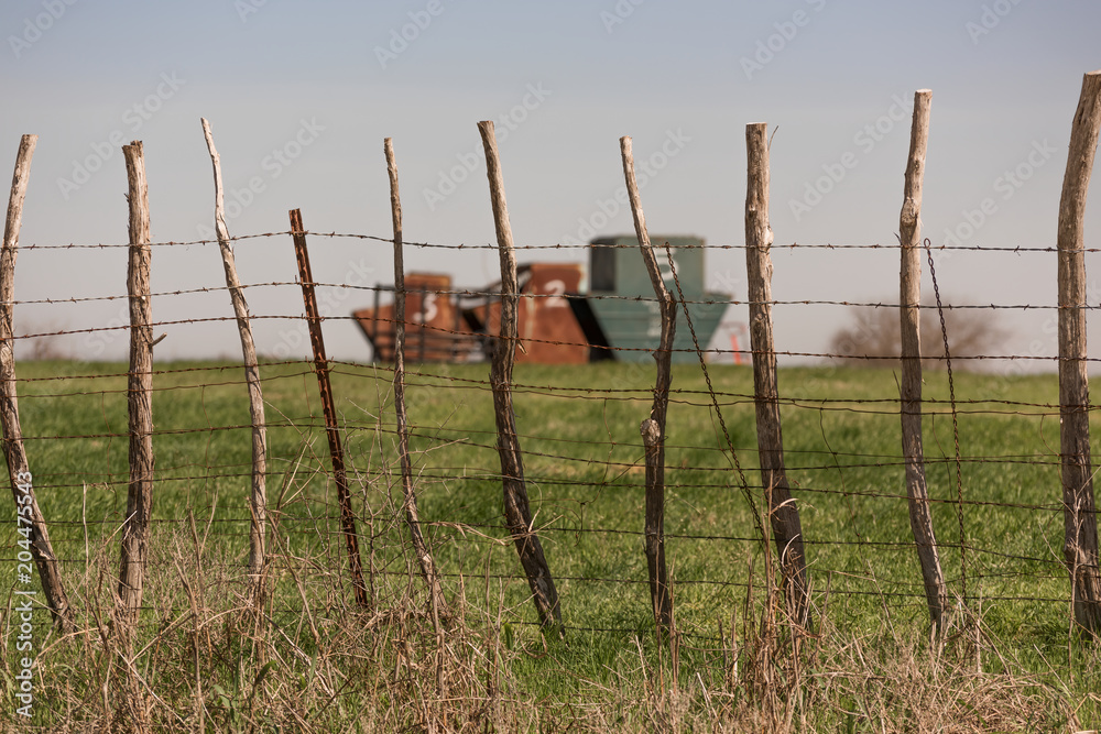 Fenceline and feeding troughs, central Texas Stock Photo | Adobe Stock