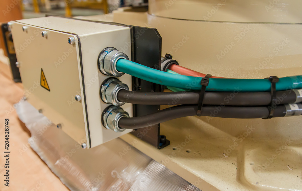 electrical cable at connected to junction box. Stock Photo | Adobe Stock