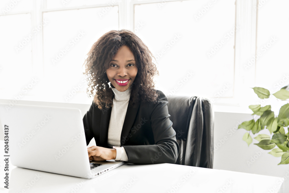 Beautiful black woman working on self employee office Stock Photo ...