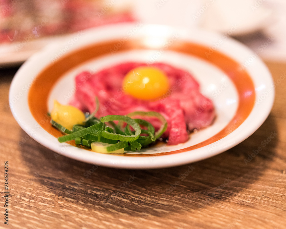 Japanese dish of beef with raw egg, Tokyo, Japan. Close-up. Stock Photo ...