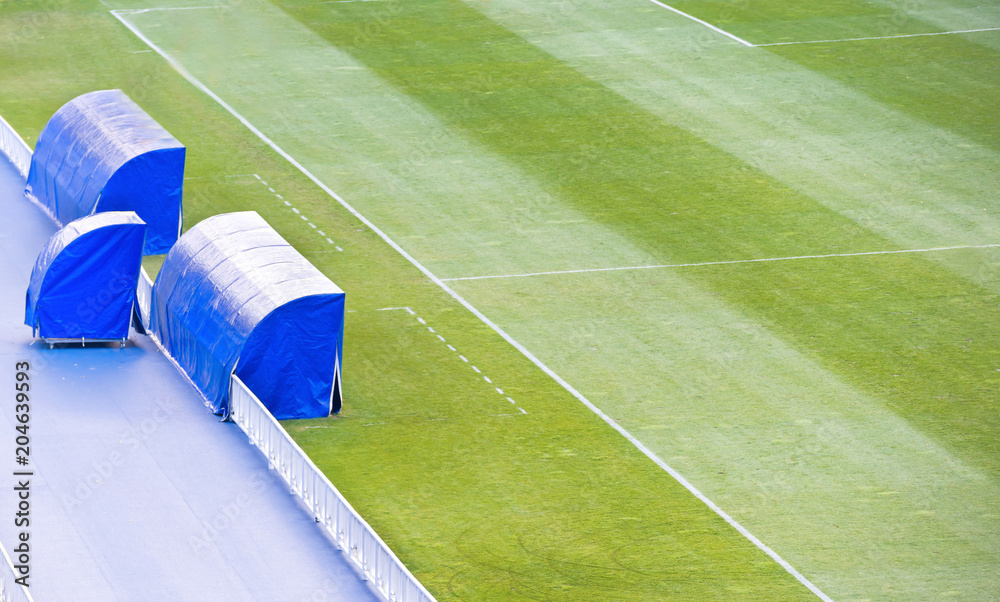 Football soccer green field with coach bench on the stadium Stock Photo ...