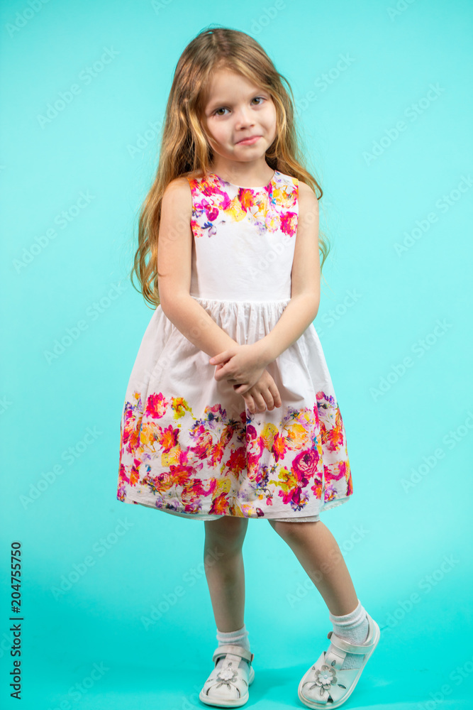Foto de Full size portrait of little shy caucasian girl with long blond ...