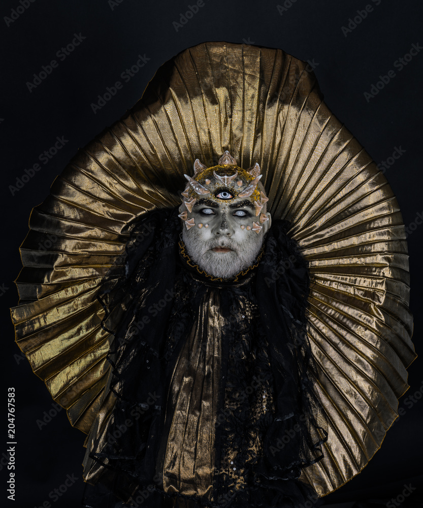 Man with third eye, thorns or warts. Demon with golden collar on black ...