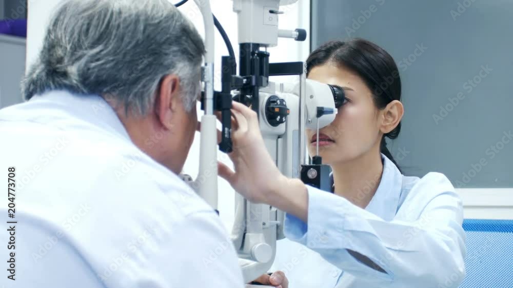 Video Stock Asian elder man test eye glass at clinic. People with ...