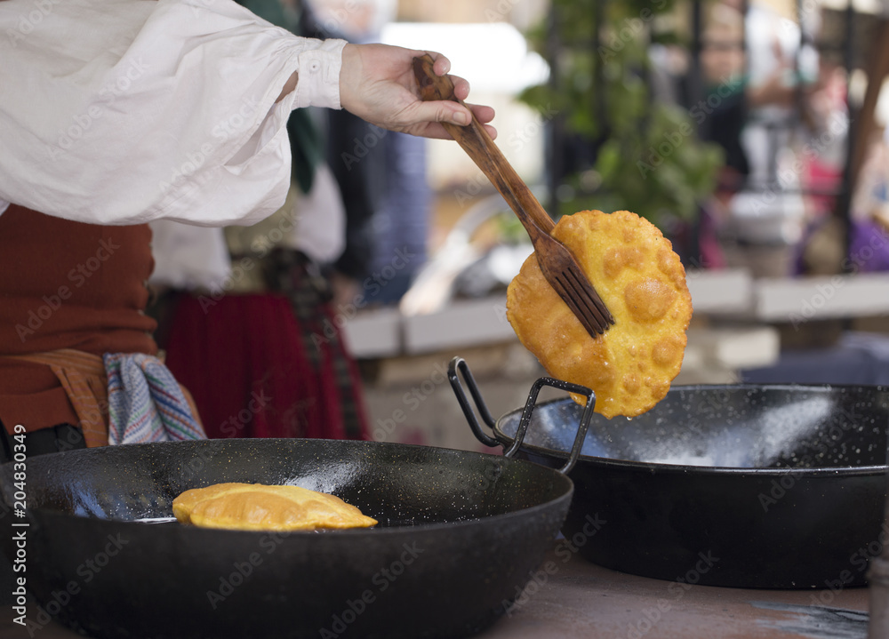 Frying torto de maíz (Corn bread is a typical food in Asturias) Stock ...
