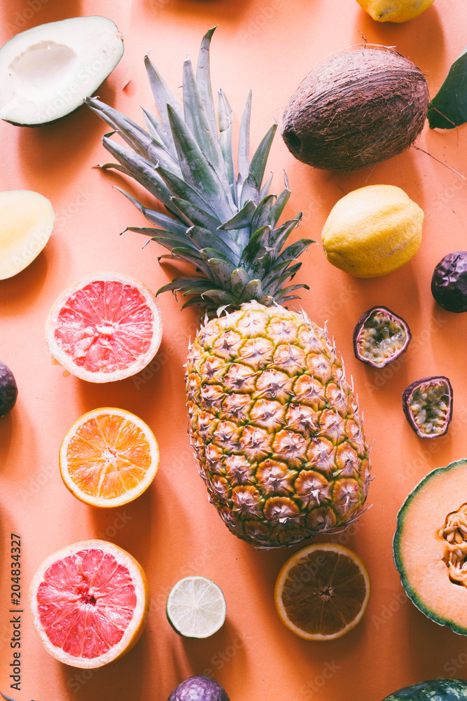 Organic exotic fruit a wallpaper over a yellow board, top view,flat lay ...