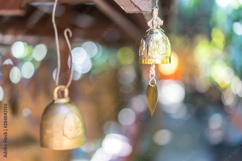 Bell of golden calm in a bright morning temple. Stock Photo | Adobe Stock