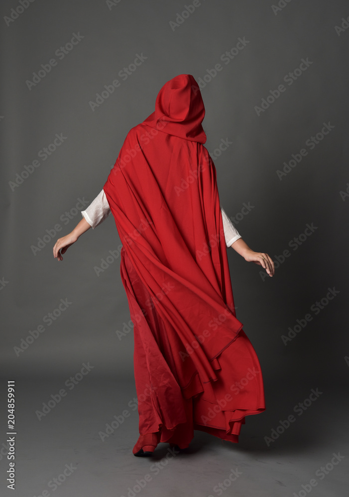 full length portrait of woman wearing red fantasy costume with cloak ...