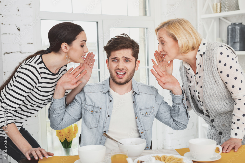 Foto de Stop talking. Cheerless young feeling stressed out while being ...