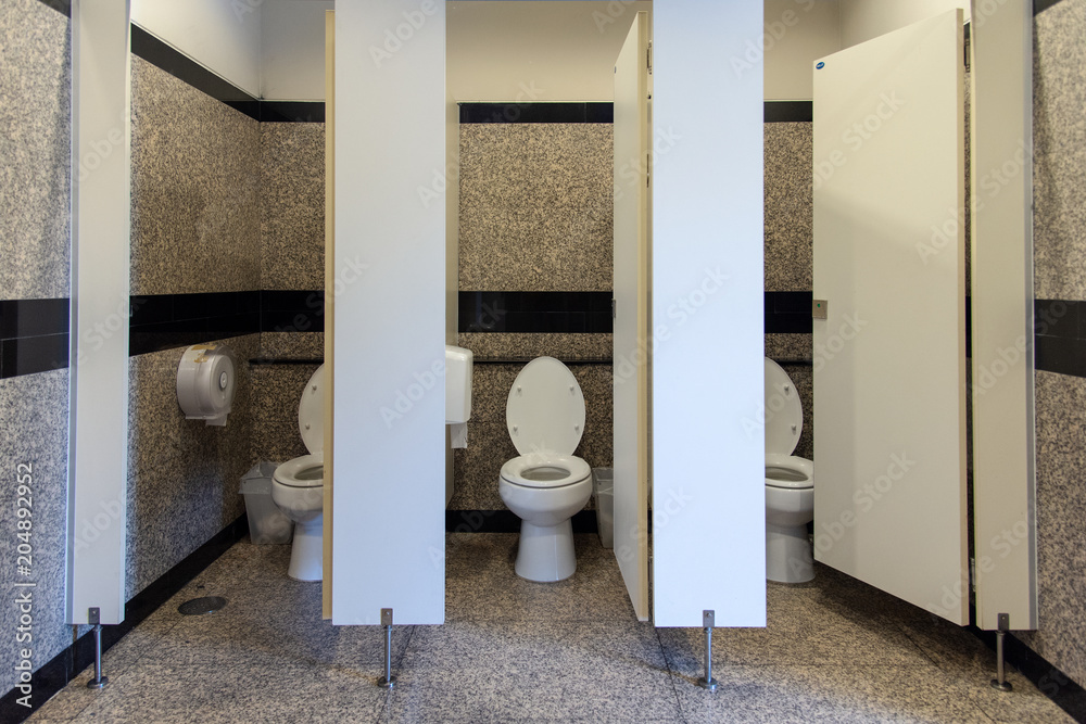 Flush toilet in Public three rooms toilet and open door Stock Photo ...
