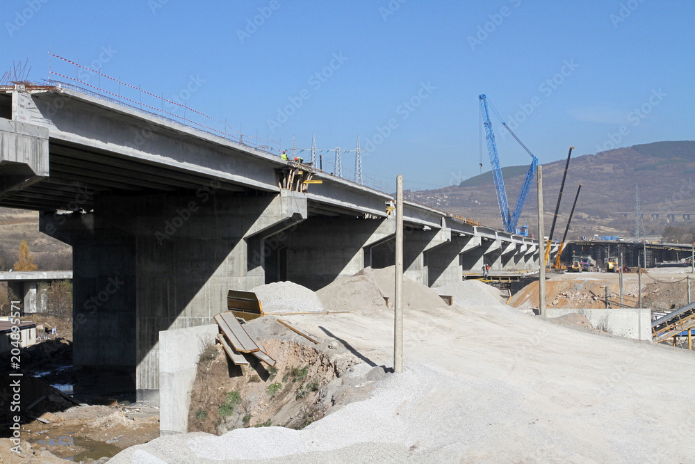 New highway under construction. A new bridge freeway made of concrete ...