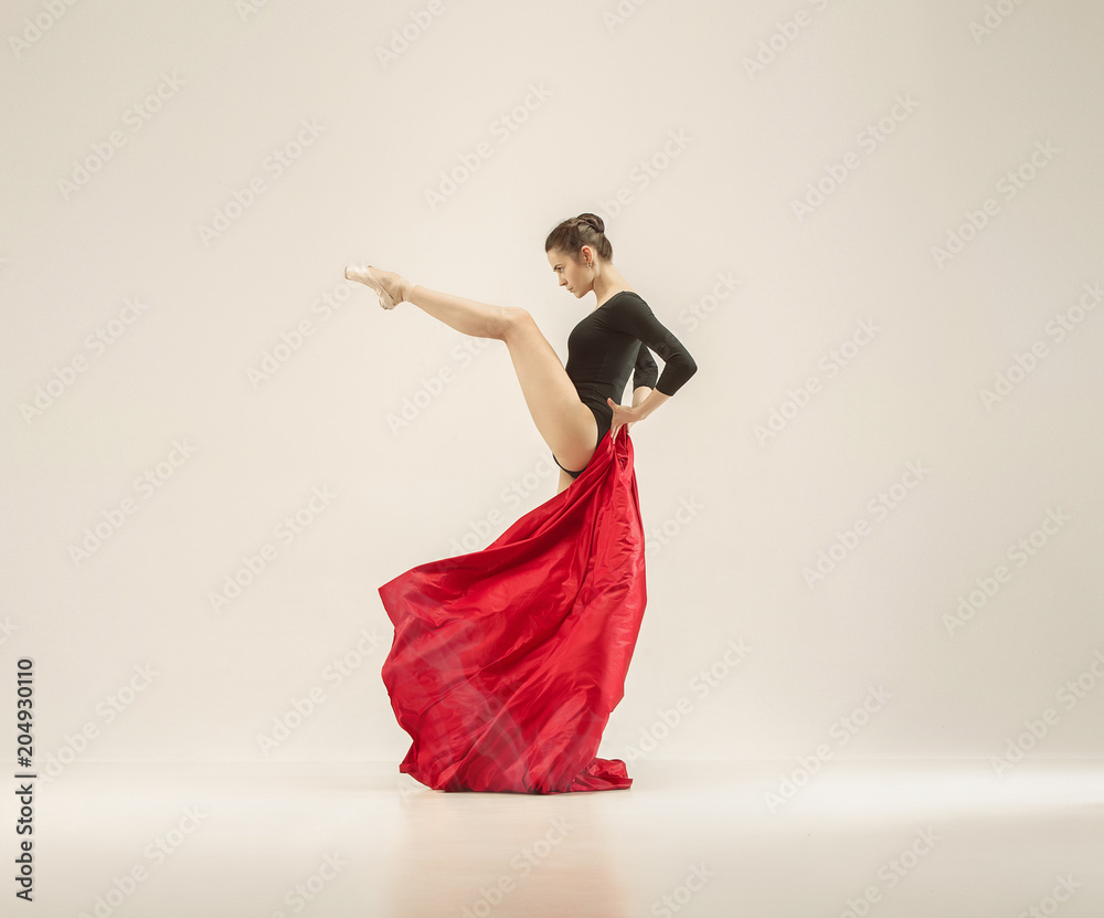 Modern ballet dancer dancing in full body on white studio background ...