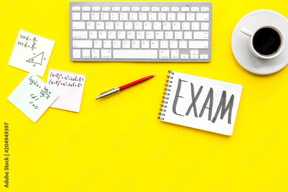 Preparing for the exam. Word Exam written in notebook on student's desk ...